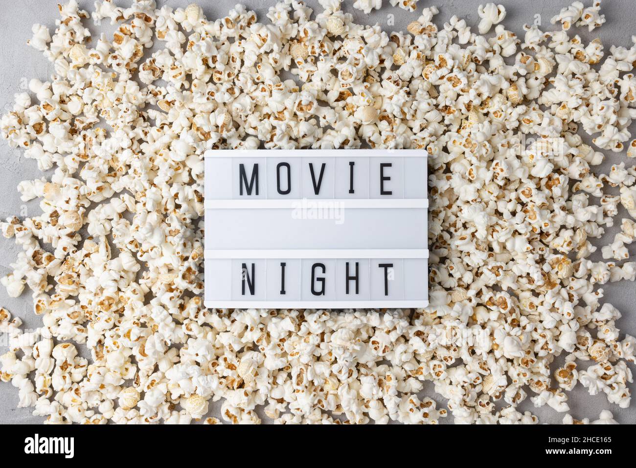 Text MOVIE NIGHT with popcorn background. Cinema, movie theater ...