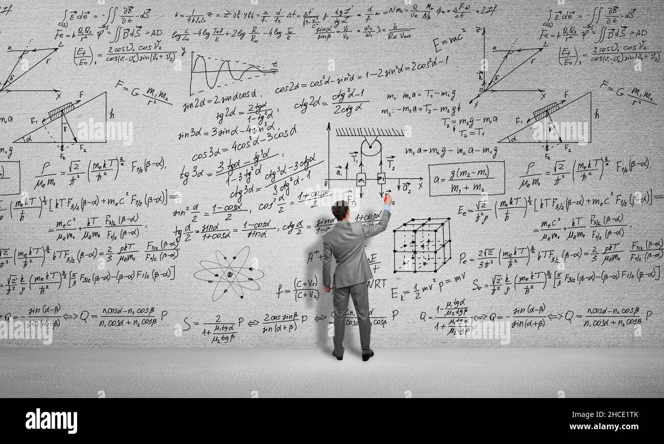 Man draw science formulas Stock Photo - Alamy