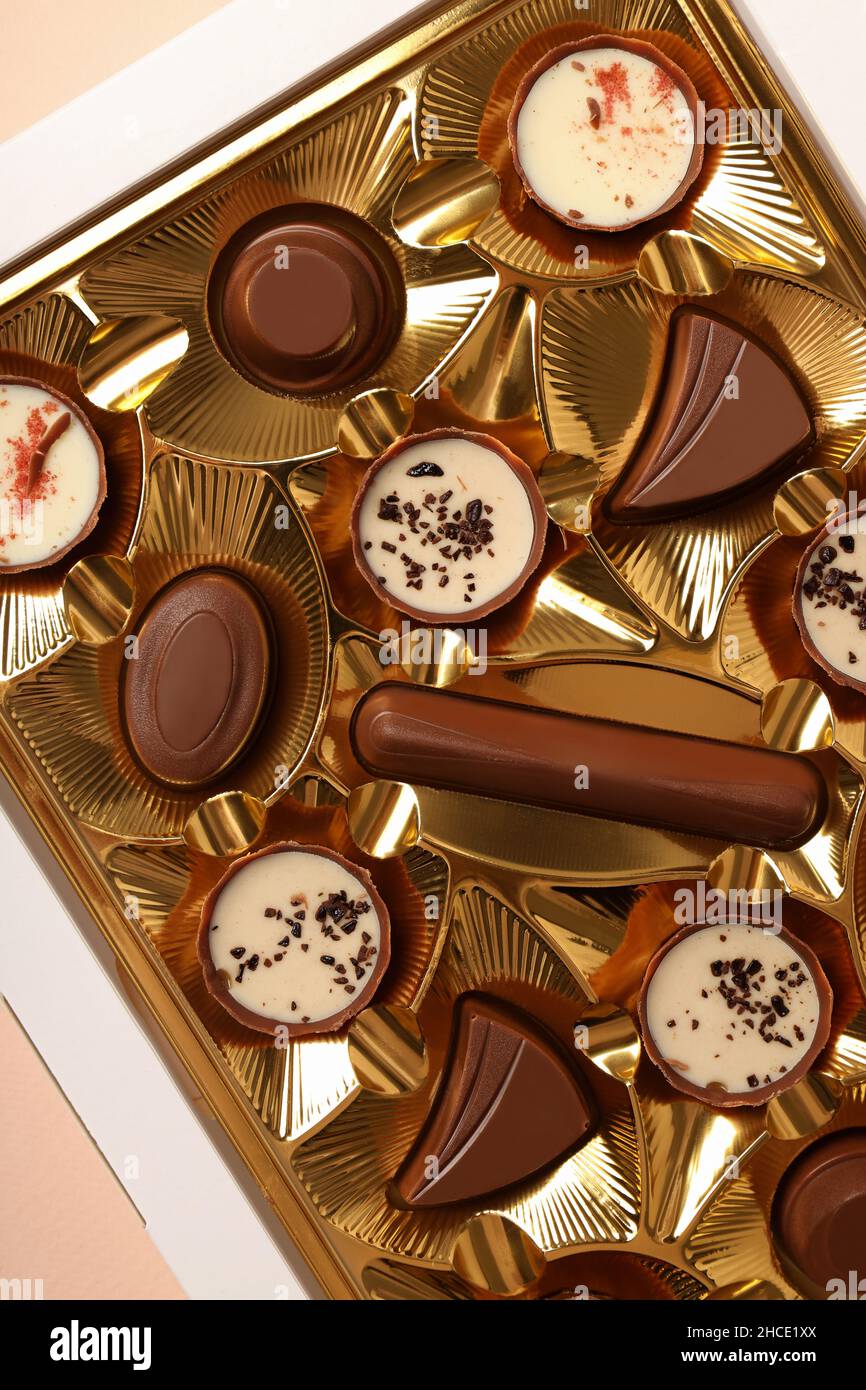 Concept of sweets with chocolate candies on beige background Stock ...