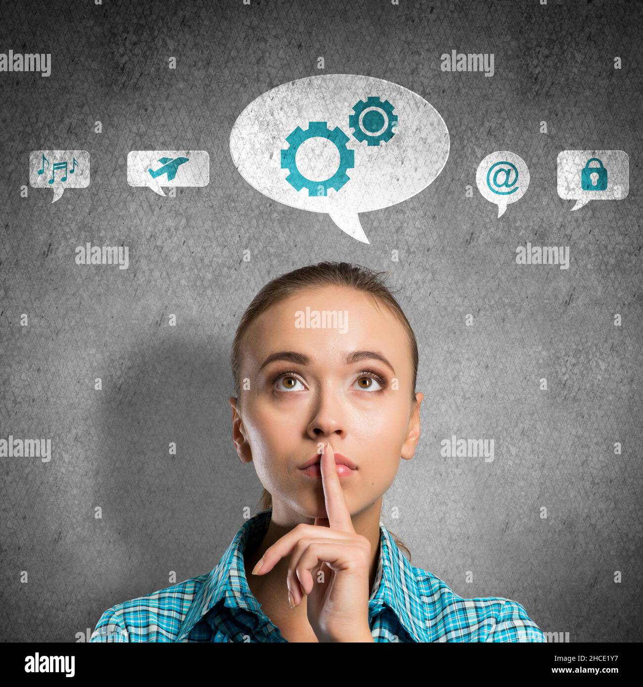 Girl showing hush gesture Stock Photo - Alamy