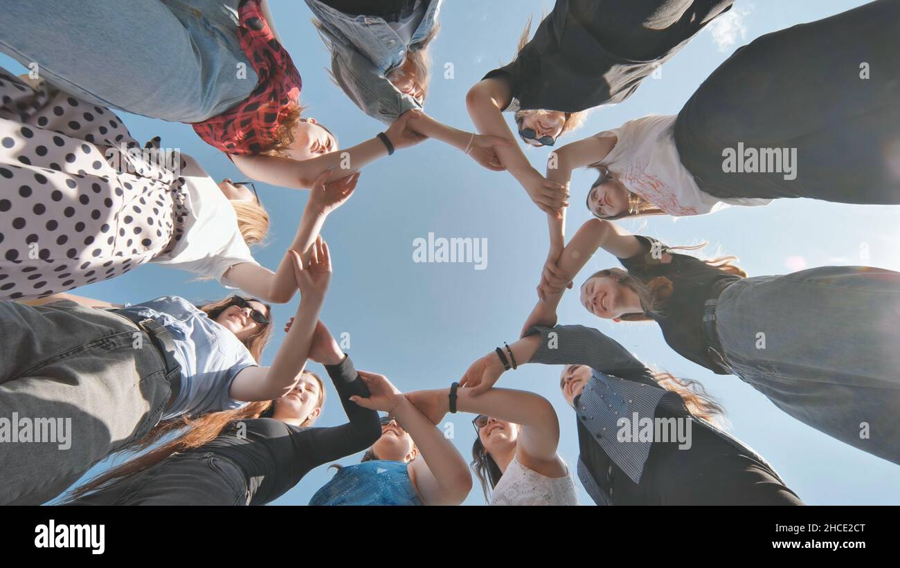 Team Huddle Hands Up Girls