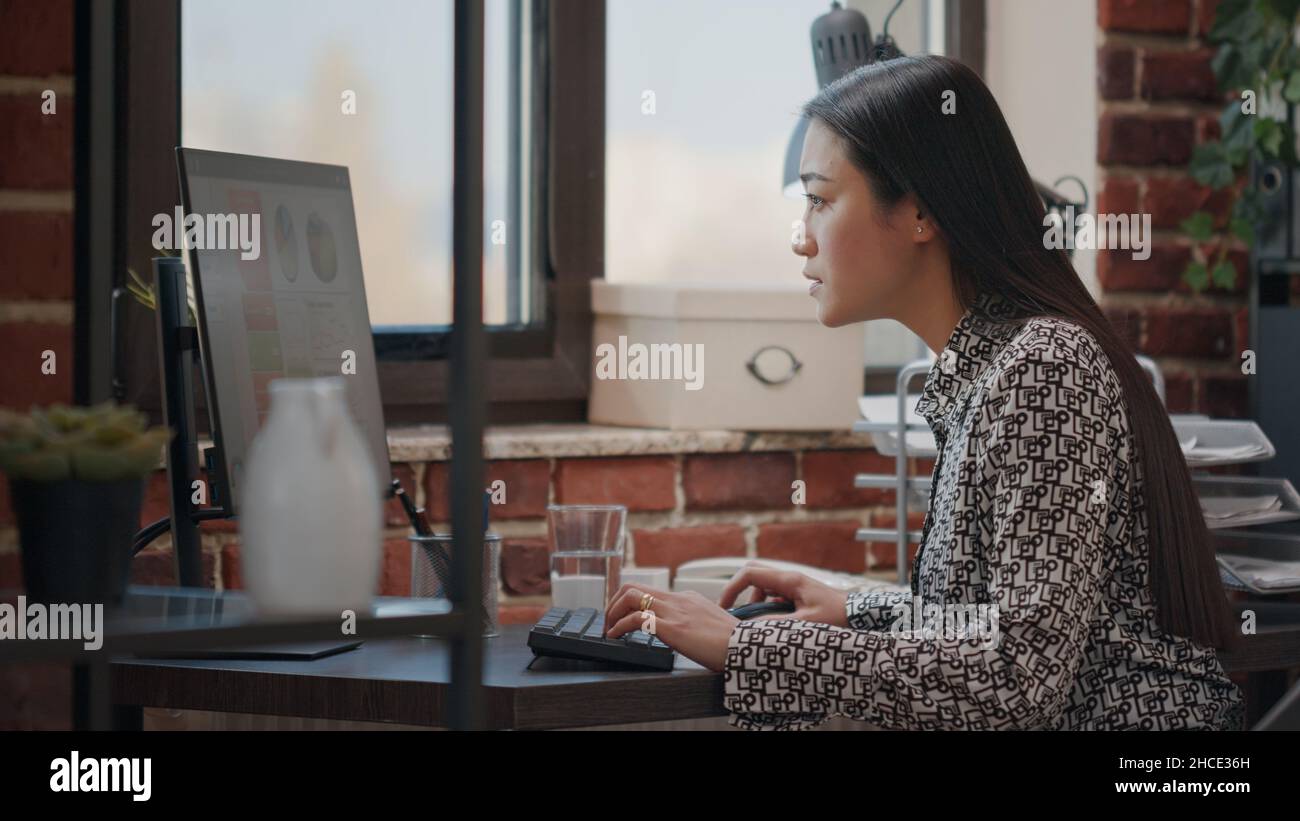 Business woman celebrating project achievement at desk, feeling ...