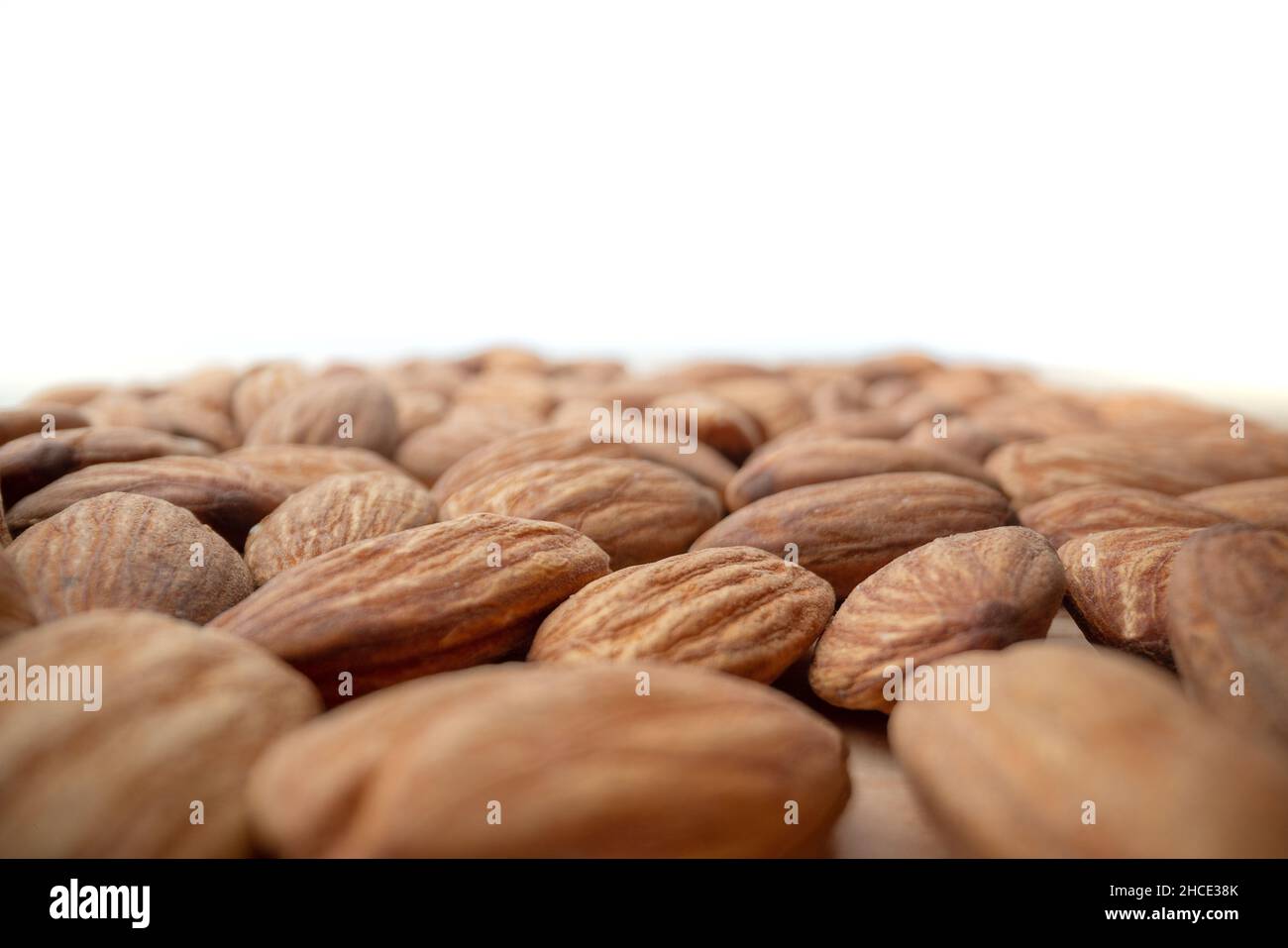 Group of almond nuts seeds in extreme close-up with short field of ...