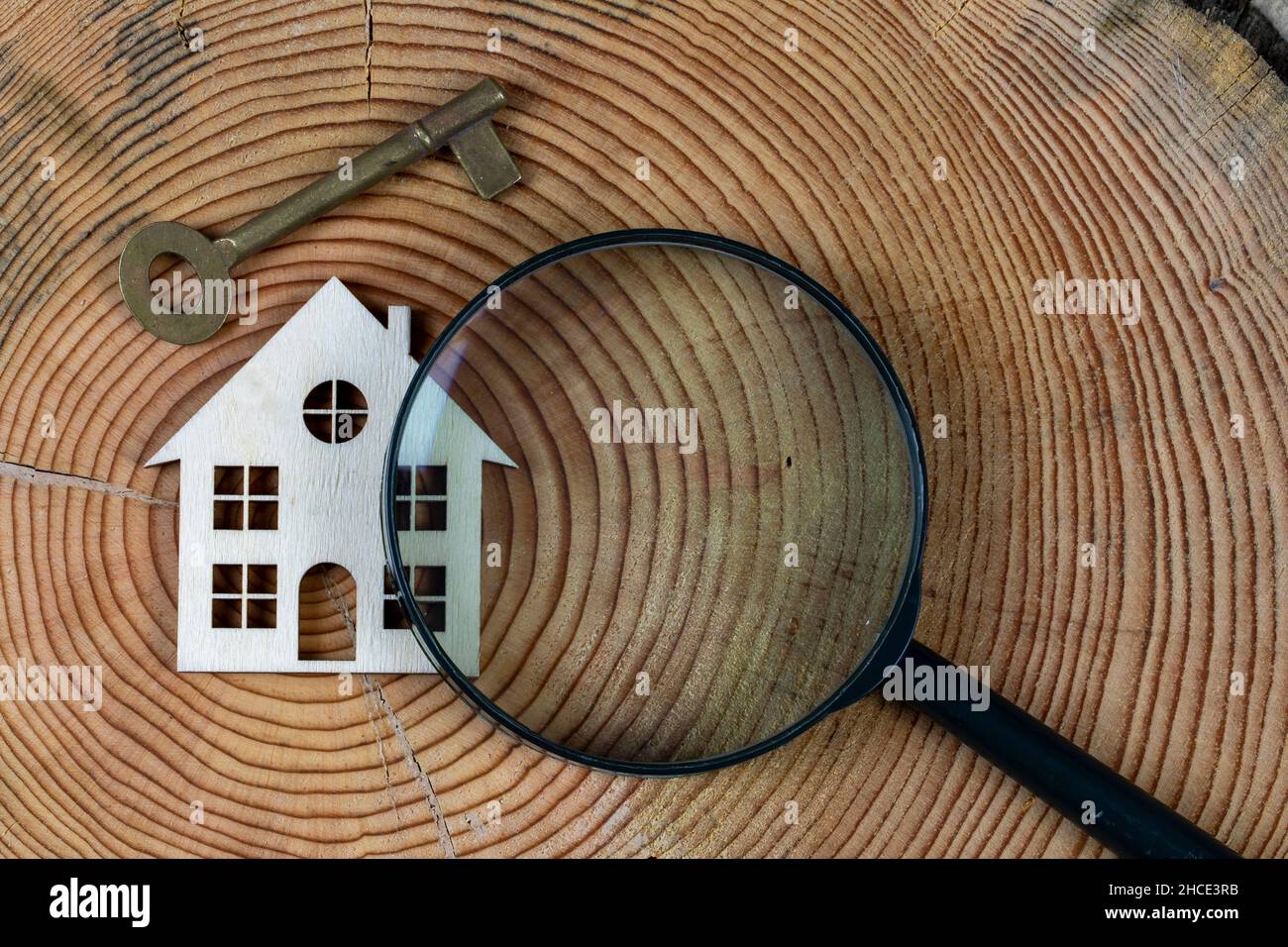 Key and House with Magnifying Glass Stock Photo - Alamy