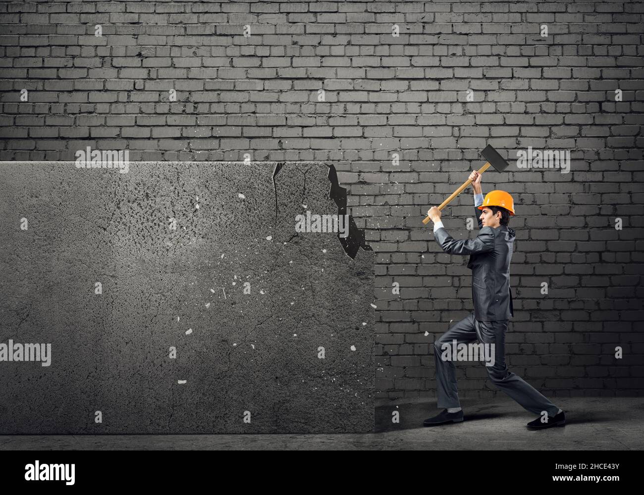 Engineer man break wall Stock Photo - Alamy