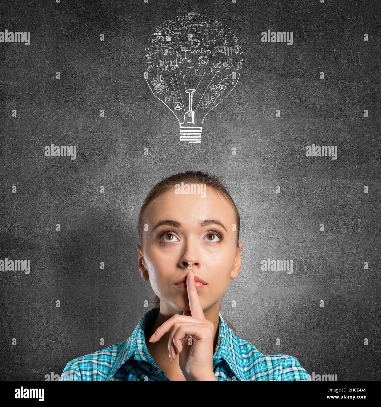 Girl showing hush gesture Stock Photo - Alamy
