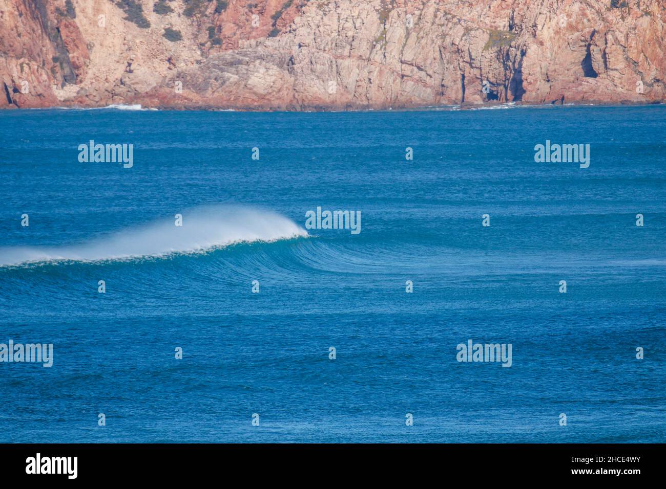 Perfect wave breaking in a beach. Surf spot Stock Photo - Alamy