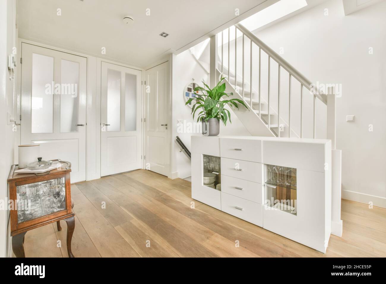 Modern interior of corridor with wooden cupboards in cottage designed ...