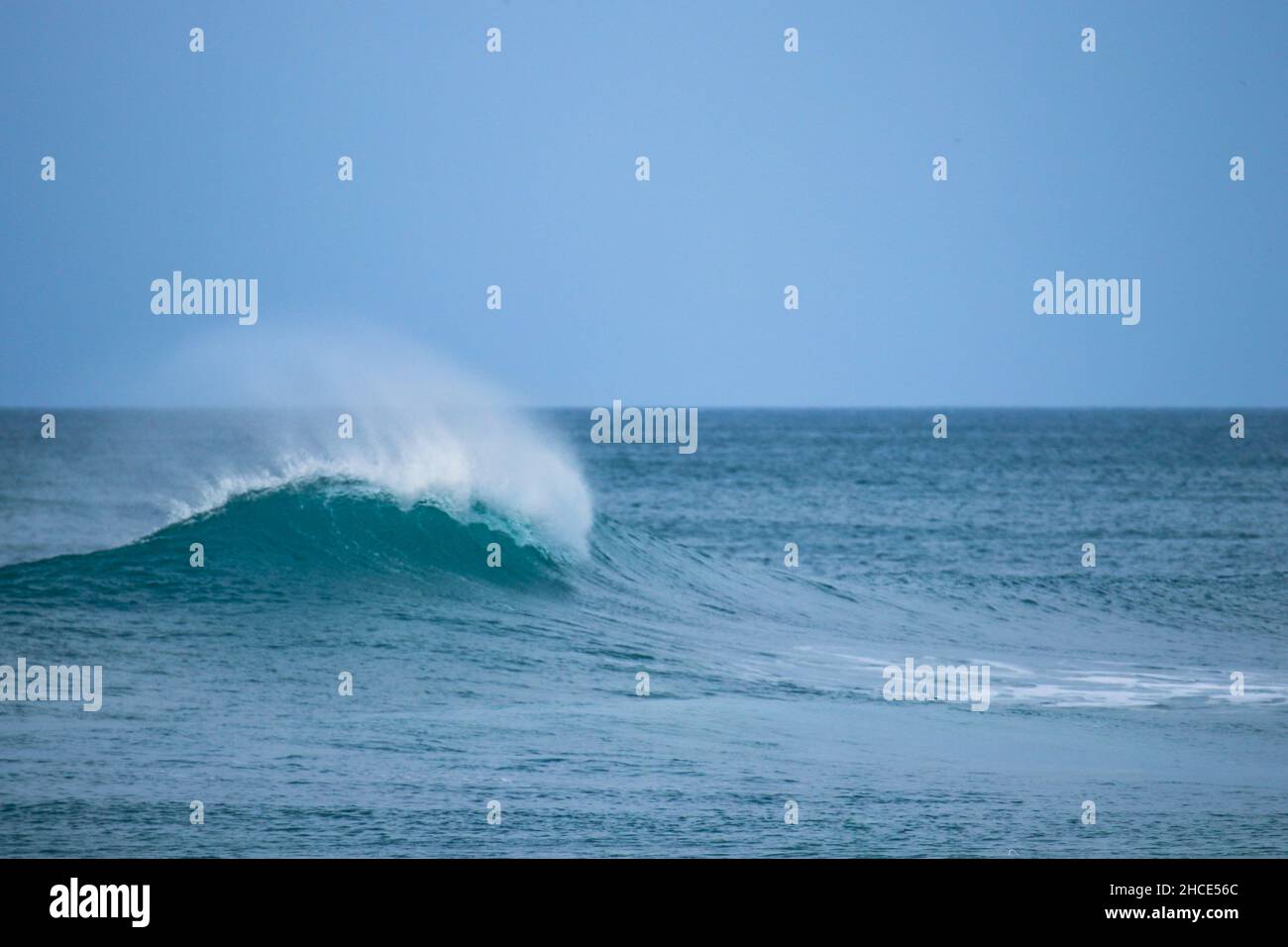 Perfect wave breaking in a beach. Surf spot Stock Photo - Alamy