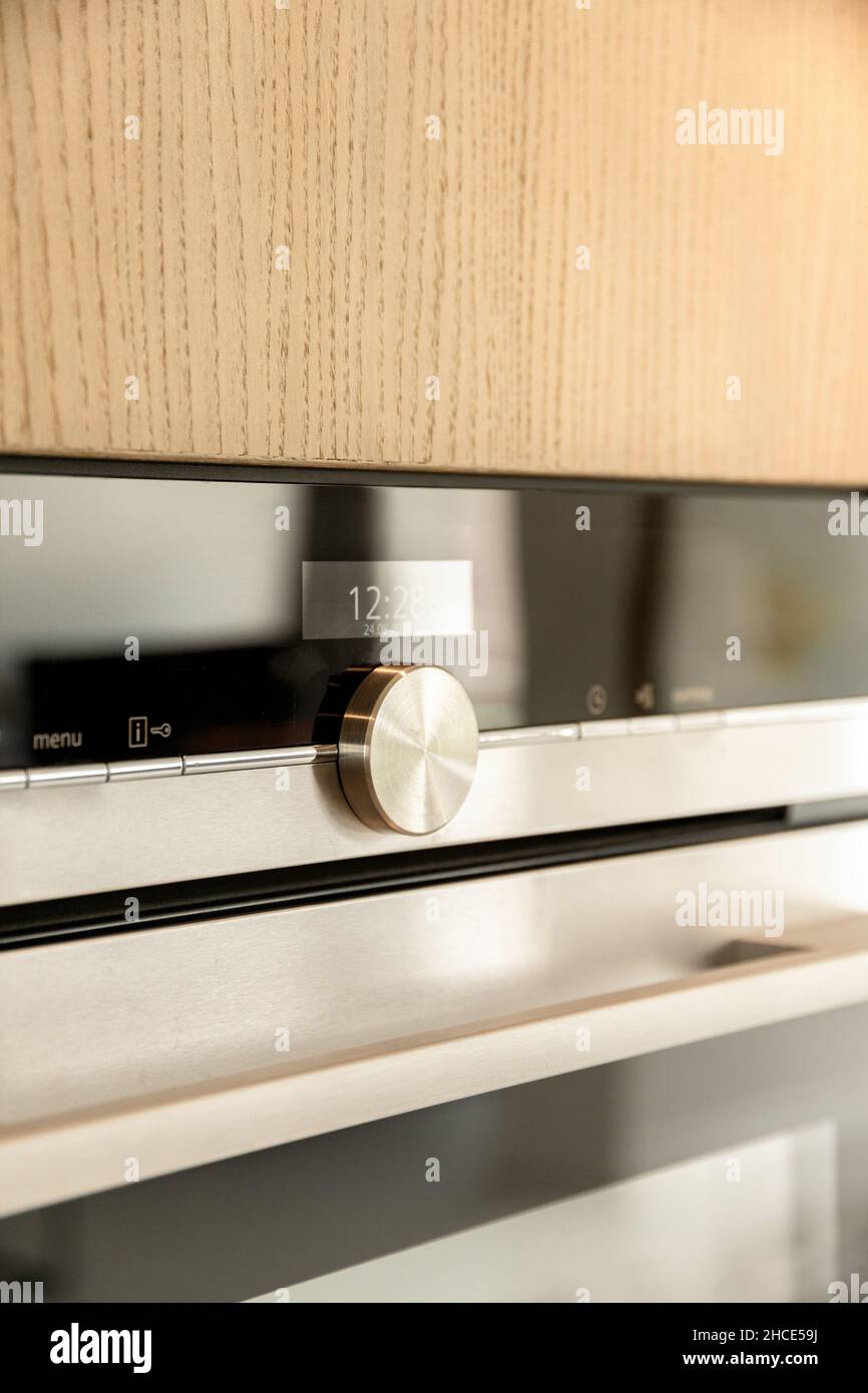 From above details of modern built in oven with indicators on display ...