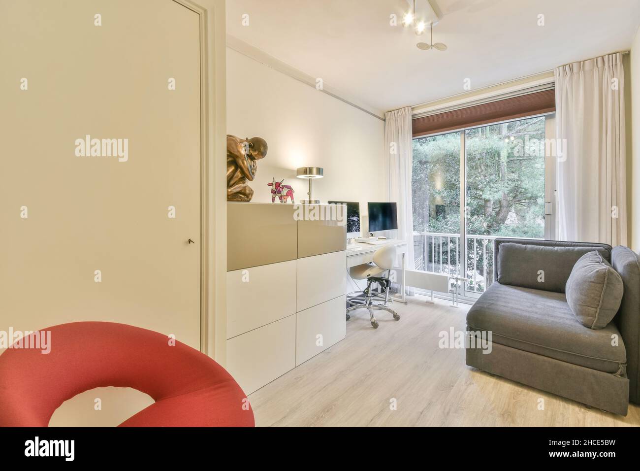 Interior of modern working room with workplace with computers placed on ...
