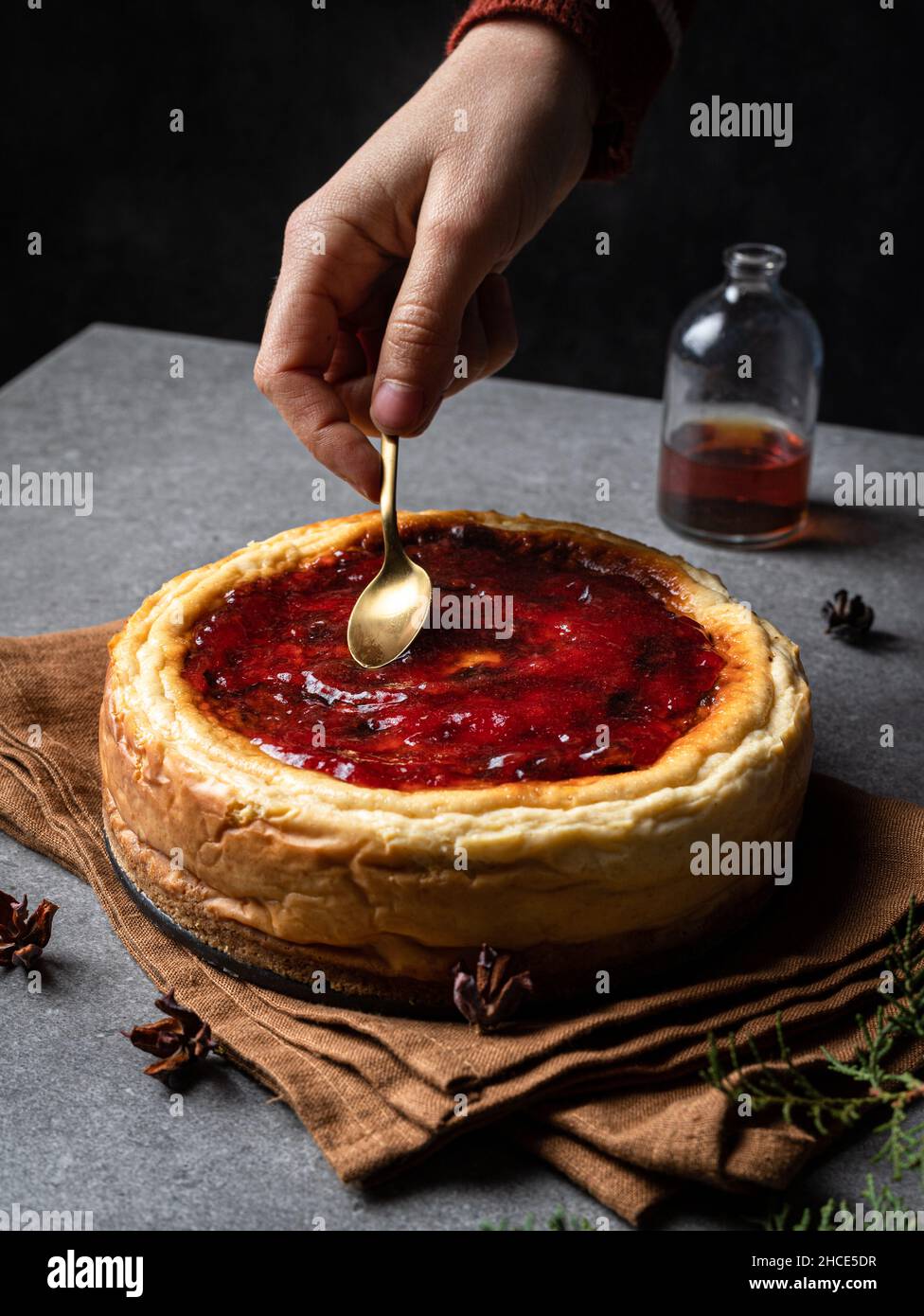 Crop unrecognizable chef spreading sweet jam on cooked homemade ...