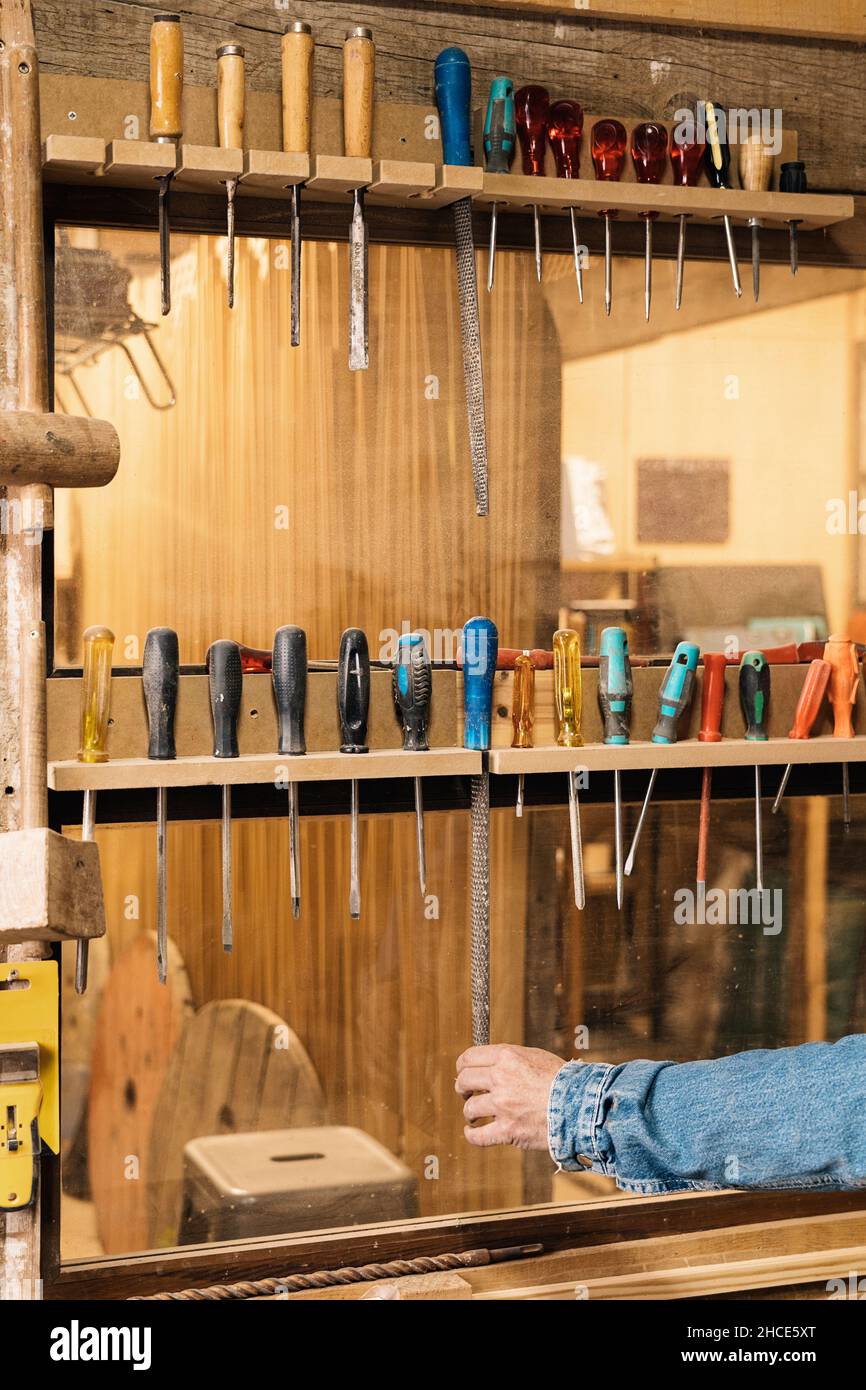 Professional worker choose instruments hi-res stock photography and ...