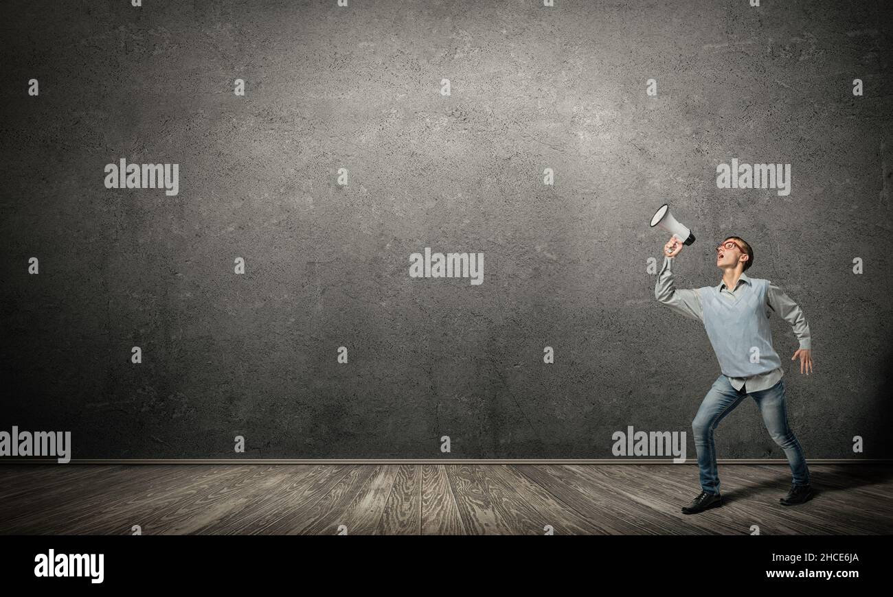 Boy with megaphone Stock Photo - Alamy