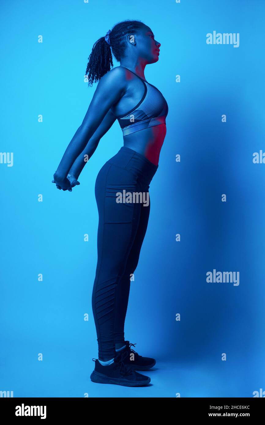 Full length side view of fit African American Woman in activewear ...