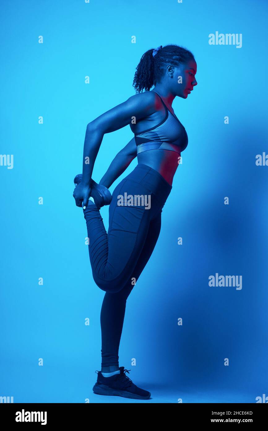 Full length side view of fit African American Woman in activewear ...