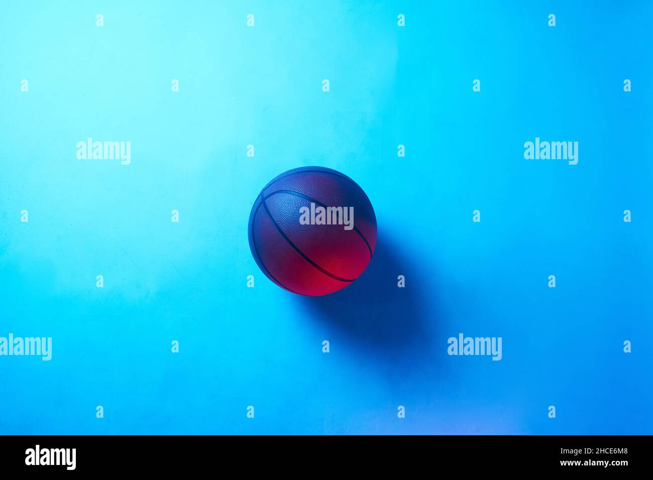 Shiny rubber surface of basketball placed on vibrant background in ...