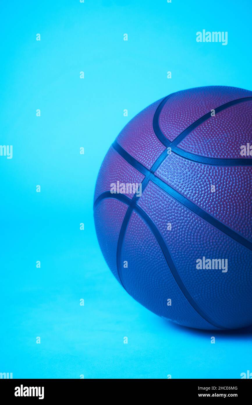 Shiny rubber surface of basketball placed on vibrant background in ...