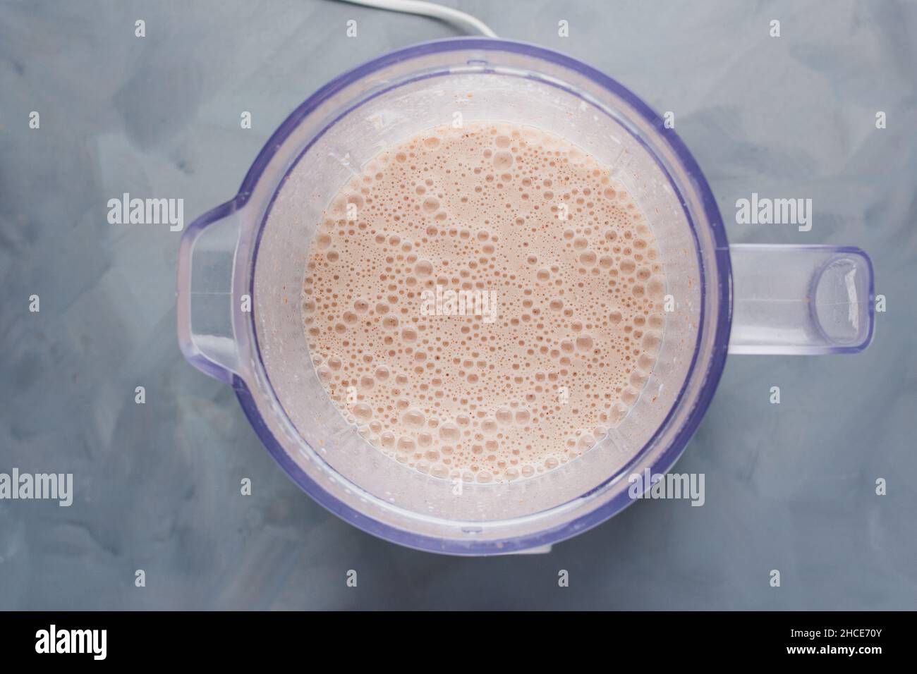 Top view of bowl of blender with mixed ingredients for milkshake Stock ...