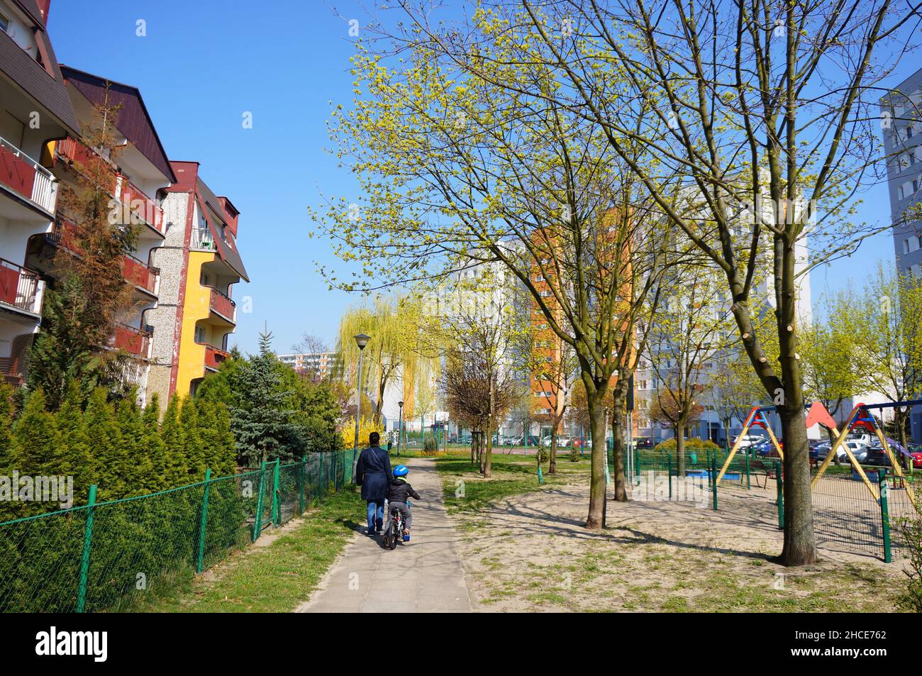 Small footpath along with trees and apartment buildings in the Stare ...