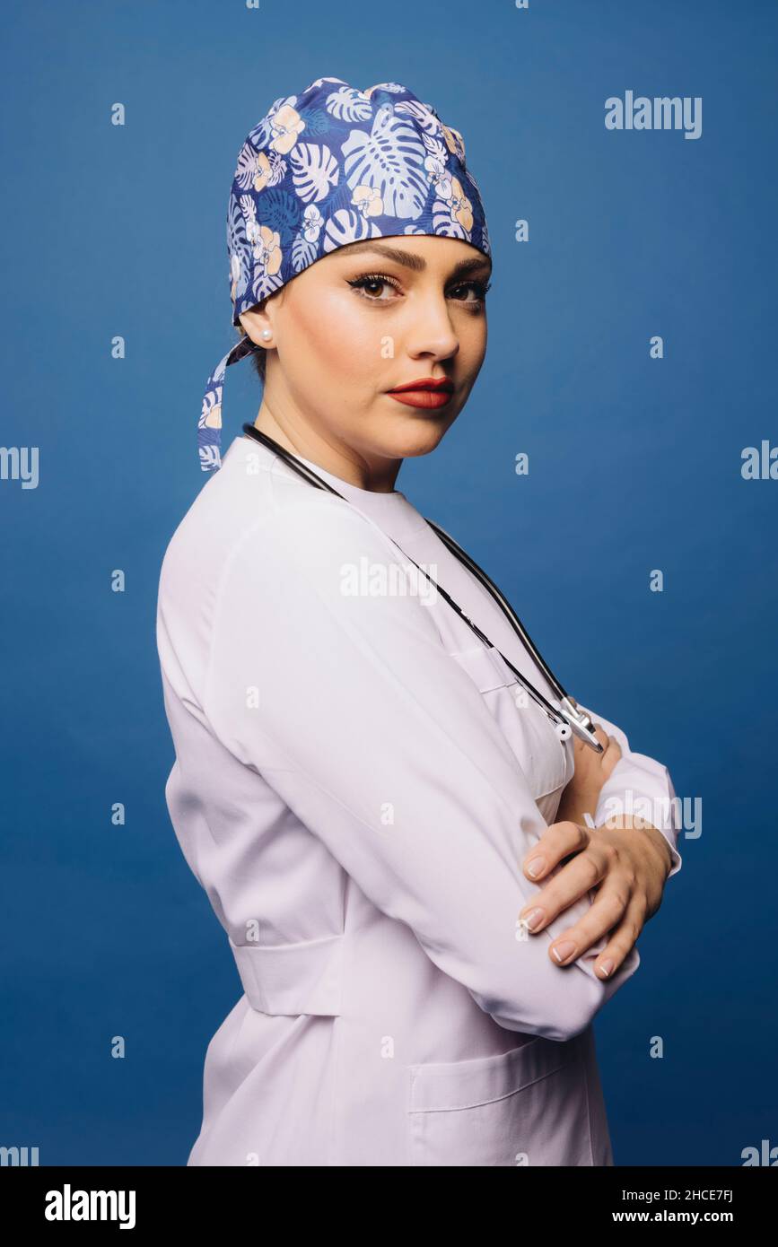 Side view of doctor Woman in white uniform robe and bandana with ...