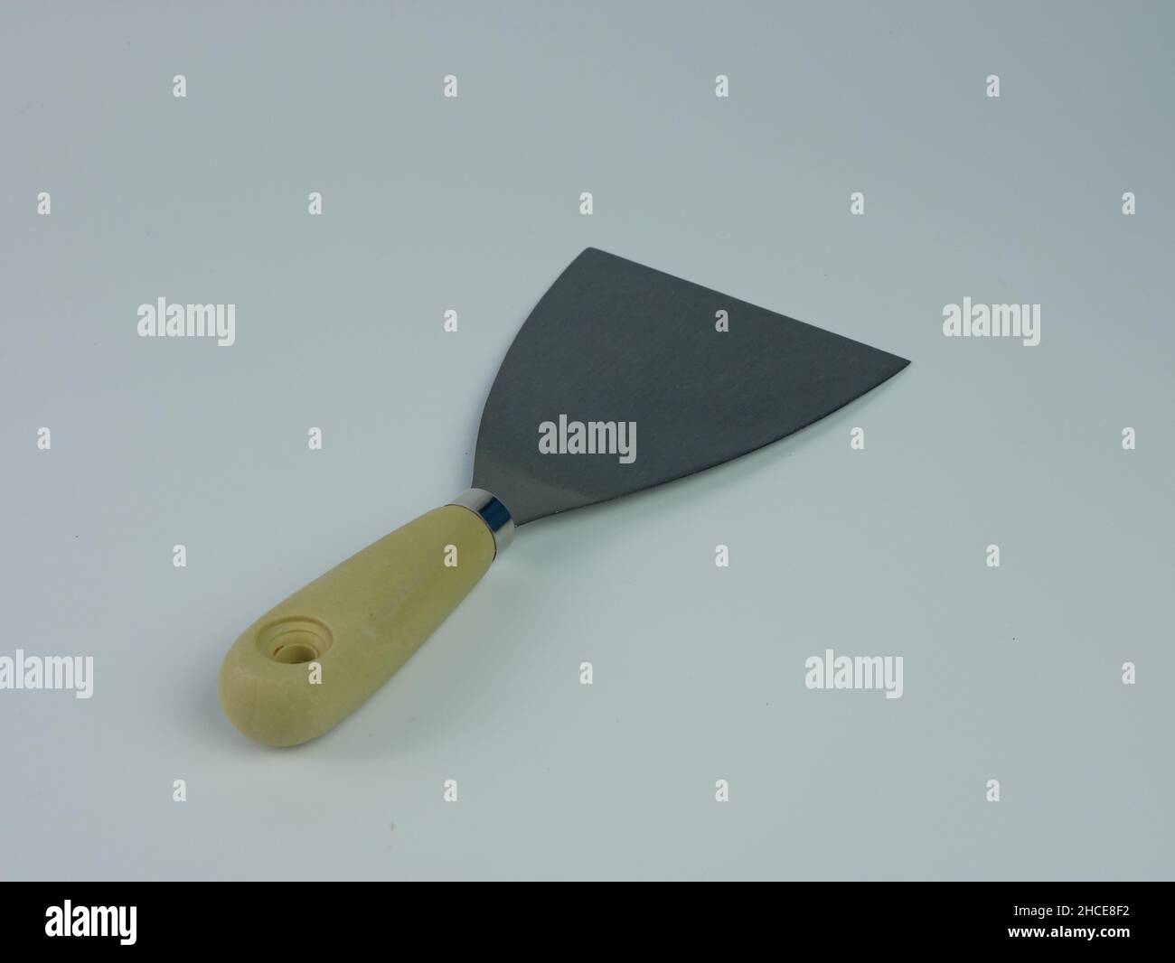 Scrapper or putty knife tool isolated on white background Stock Photo ...