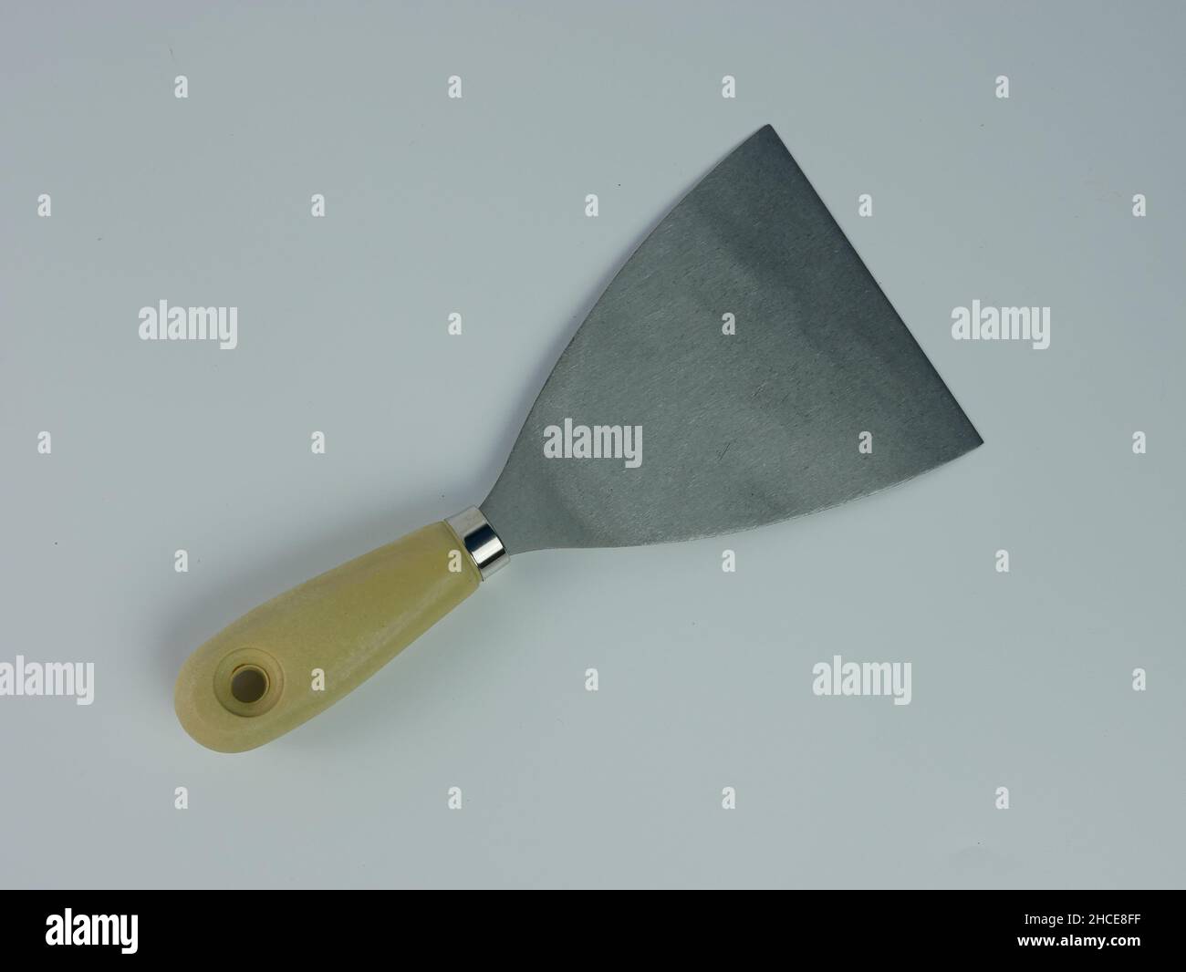 Scrapper or putty knife tool isolated on white background Stock Photo ...