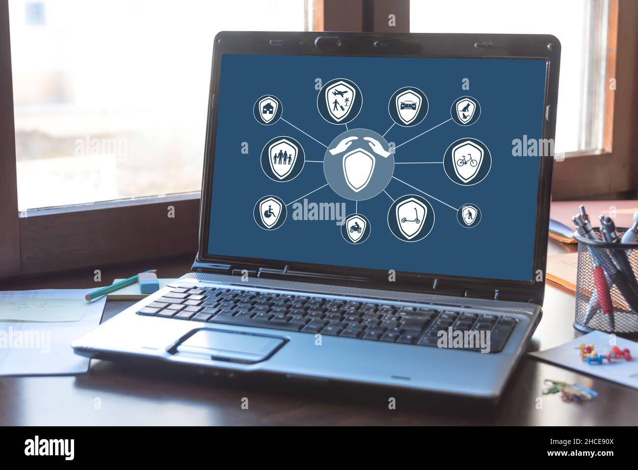 Laptop screen displaying an insurance concept Stock Photo - Alamy
