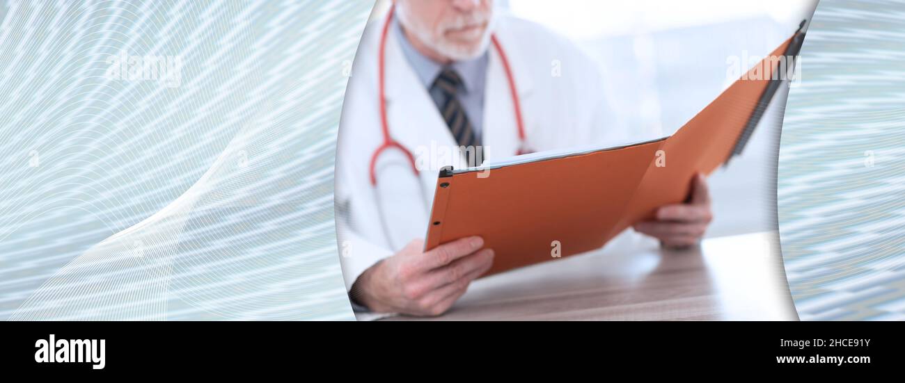 Doctor reading a medical report in office; panoramic banner Stock Photo ...