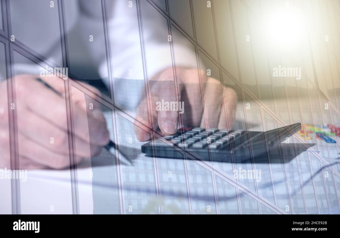 Male hand using calculator, accounting concept, light effect, double ...