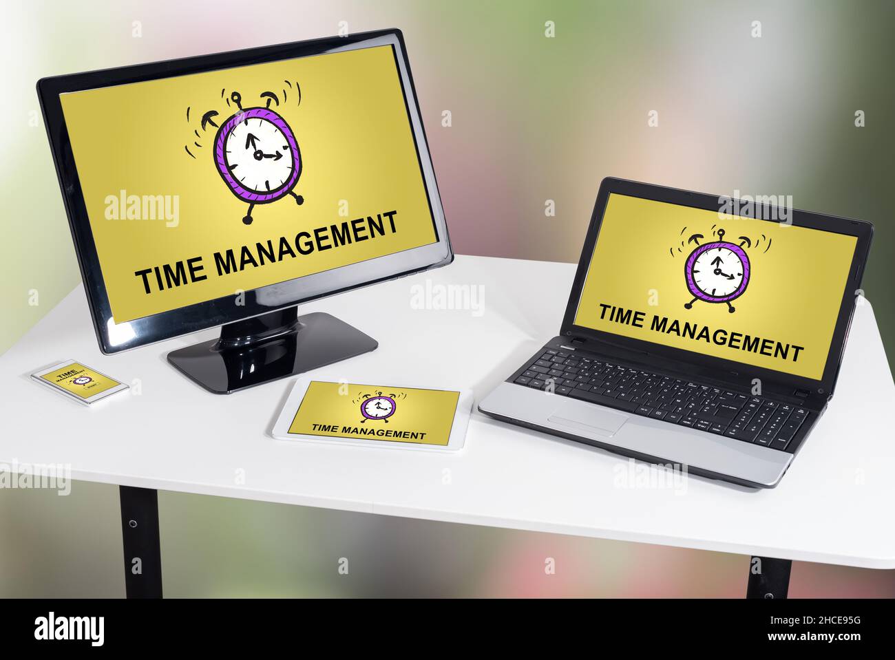 Time management concept shown on different information technology ...