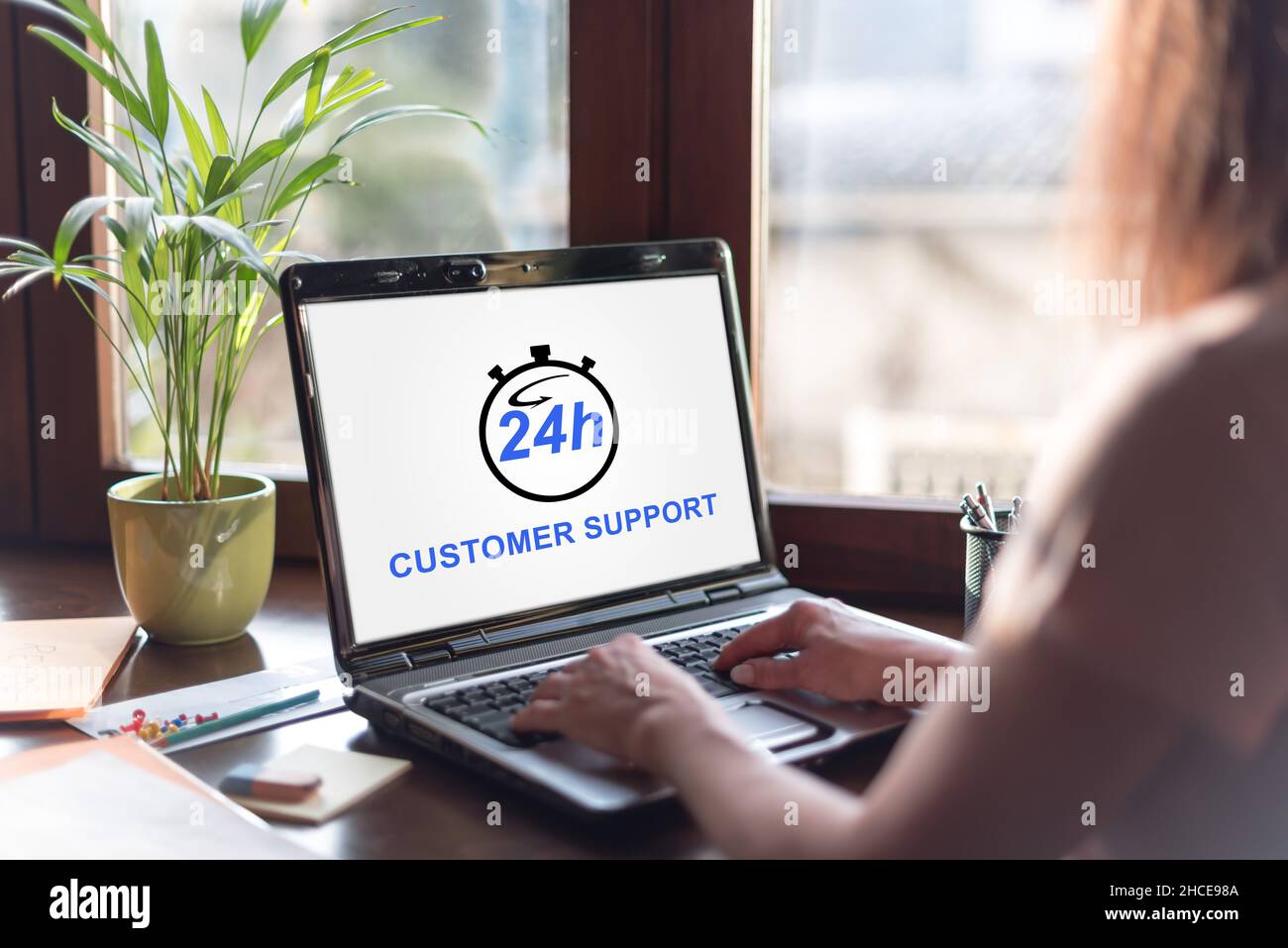 Laptop screen displaying a customer support concept Stock Photo - Alamy