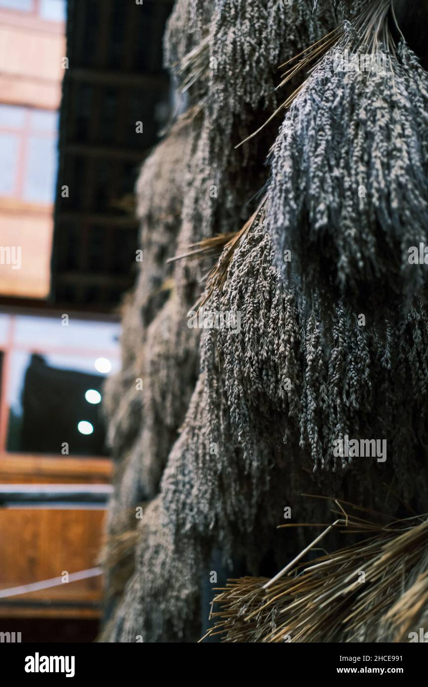 Rice hanging from a wooden frame Stock Photo - Alamy