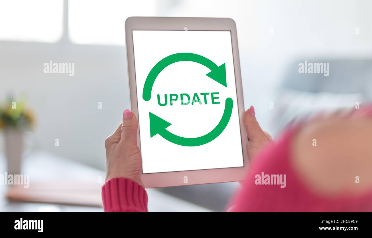 Tablet screen displaying an update concept Stock Photo - Alamy