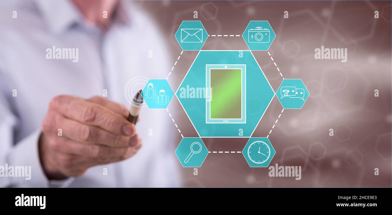 Man touching an apps concept on a touch screen with a pen Stock Photo ...