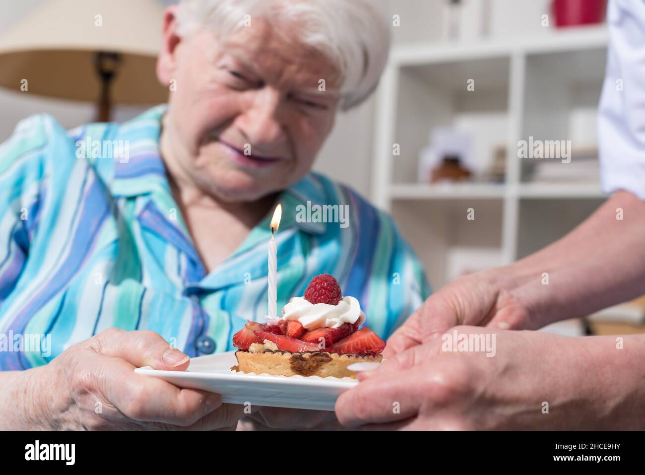 Woman receiving birthday cake hi-res stock photography and images - Alamy