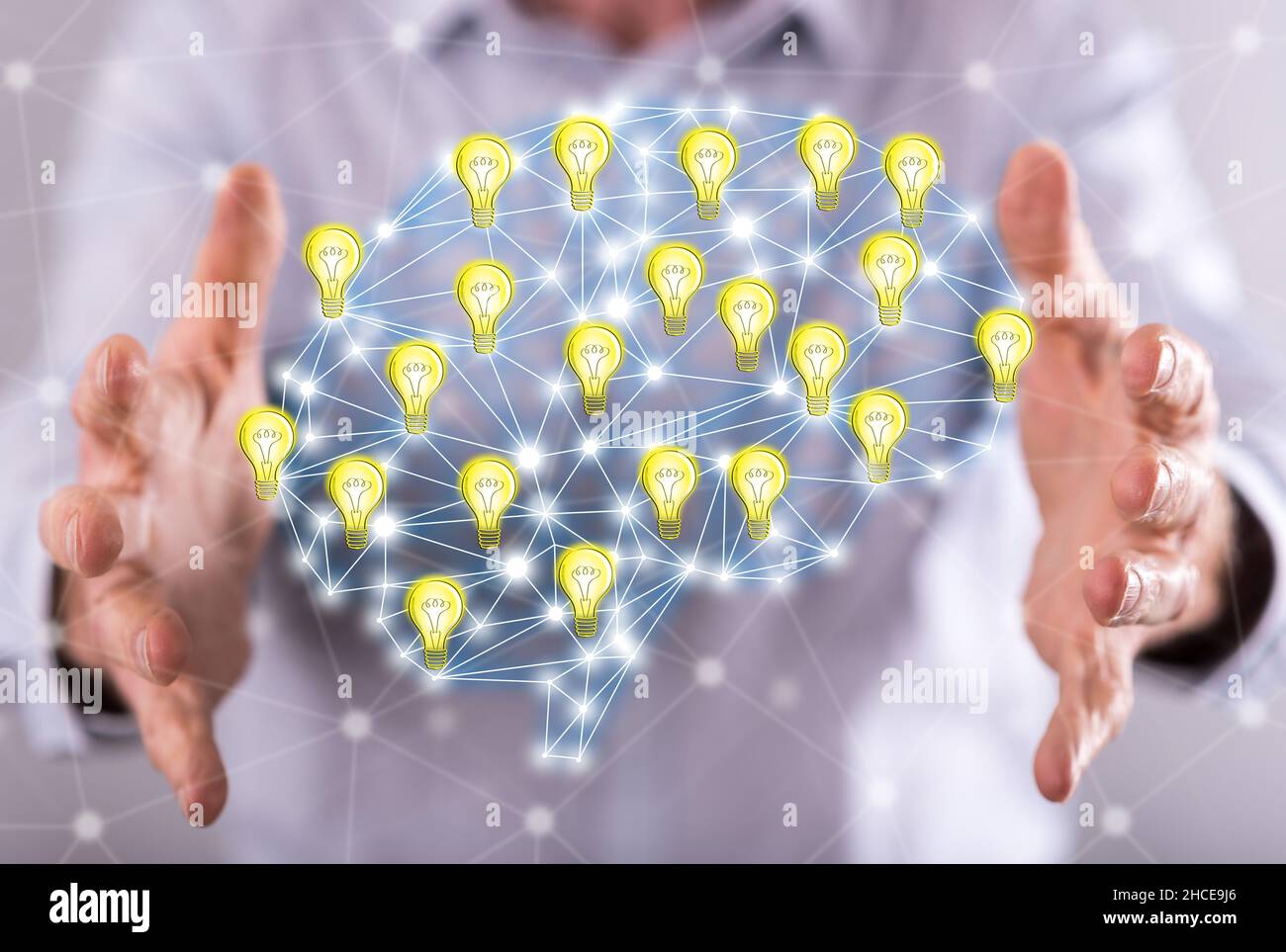 Creative concept between hands of a man in background Stock Photo - Alamy