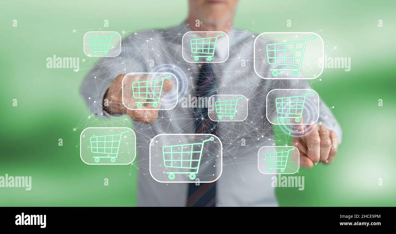 Man touching an online shopping concept on a touch screen with his ...