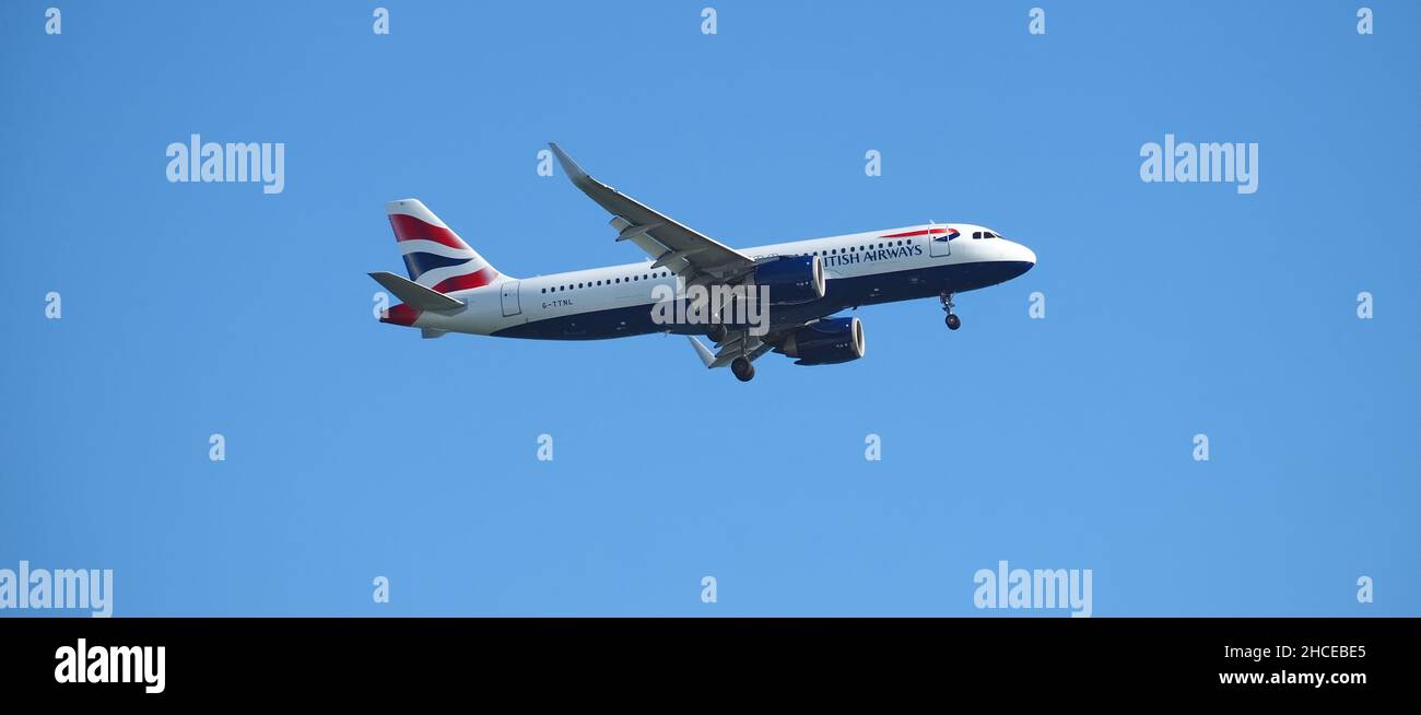 British Airways plane flying with blue sky Stock Photo - Alamy