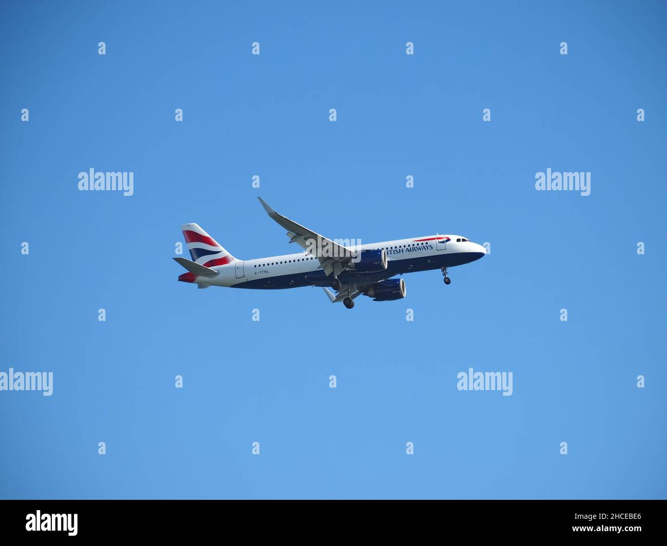 British Airways plane flying with blue sky Stock Photo - Alamy