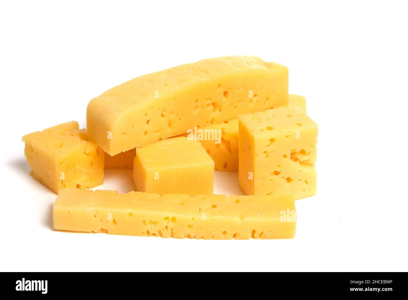 Slices of sliced cheese on a white background Stock Photo - Alamy