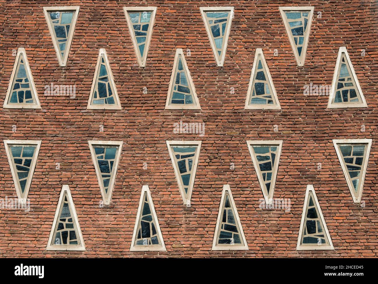Many windows in 4 rows on a facade of a building Stock Photo - Alamy
