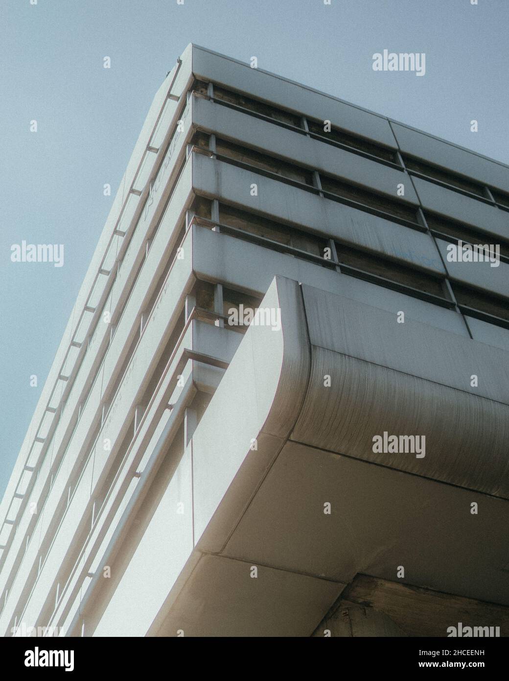 Vertical low-angle shot of a modern building facade Stock Photo - Alamy