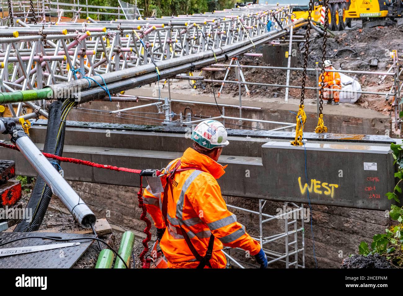 Railway workers building new railway and knocking down bridges Stock ...