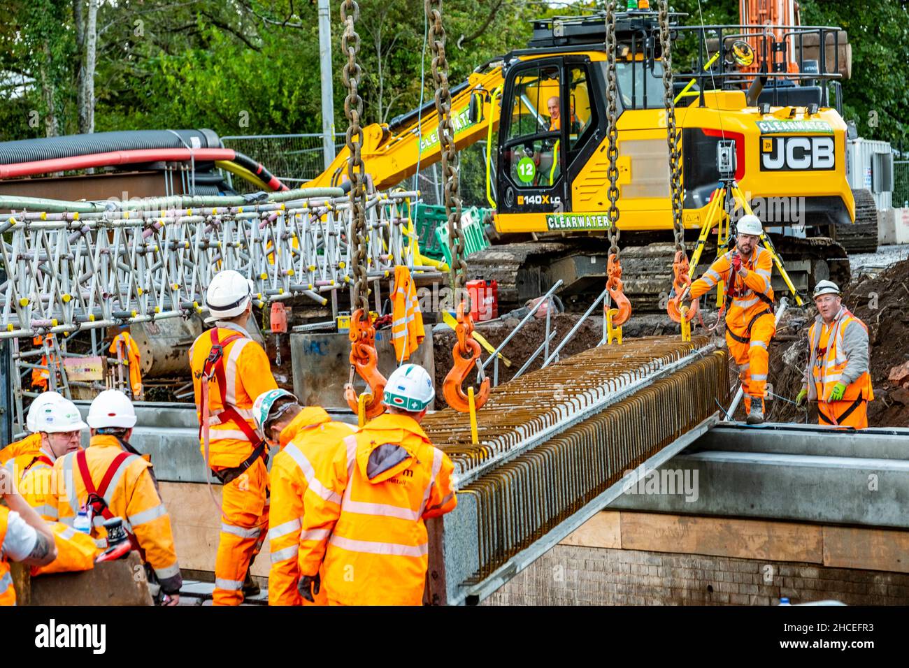 Railway workers building new railway and knocking down bridges Stock ...