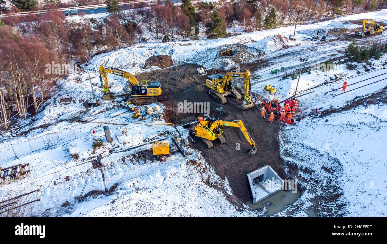 Railway workers building new railway and knocking down bridges Stock ...