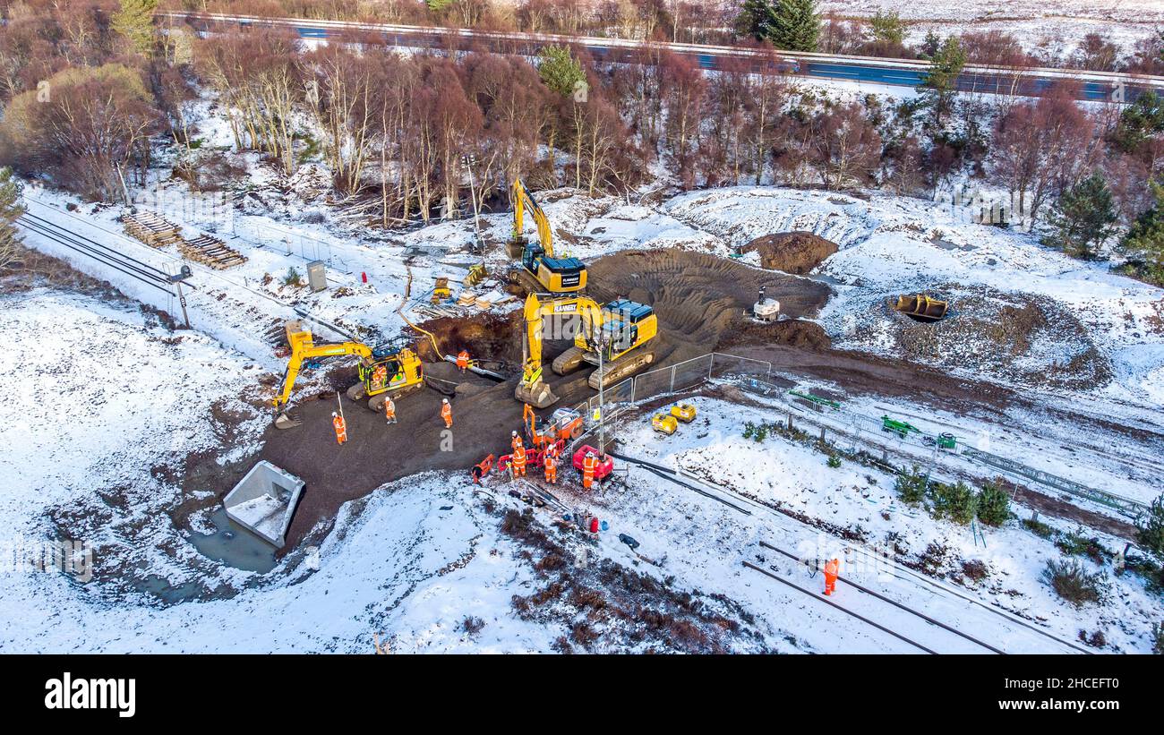 Railway workers building new railway and knocking down bridges Stock ...