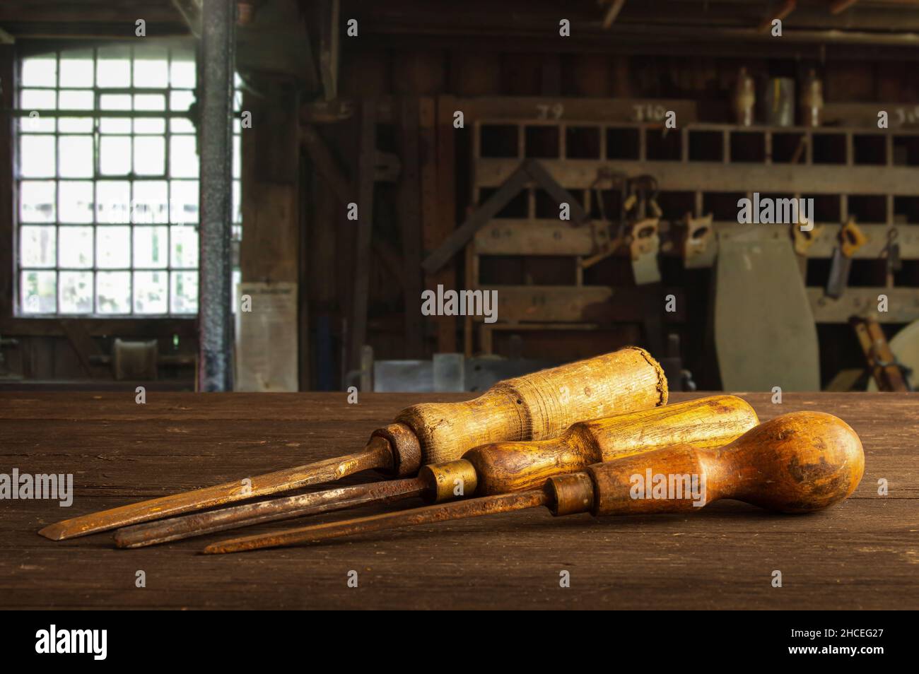 Three old wood chisels in a carpenters workshop Stock Photo - Alamy