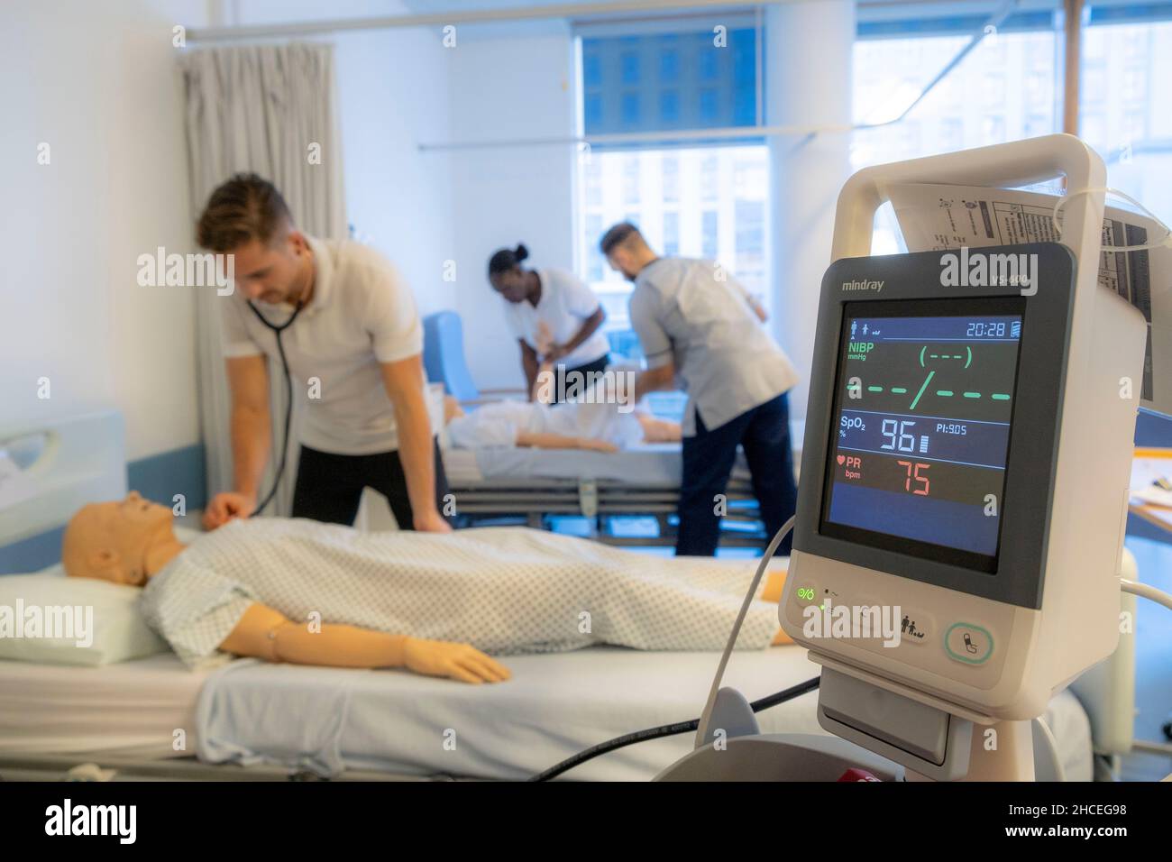 Student nurses training realistic medical dummy Stock Photo - Alamy