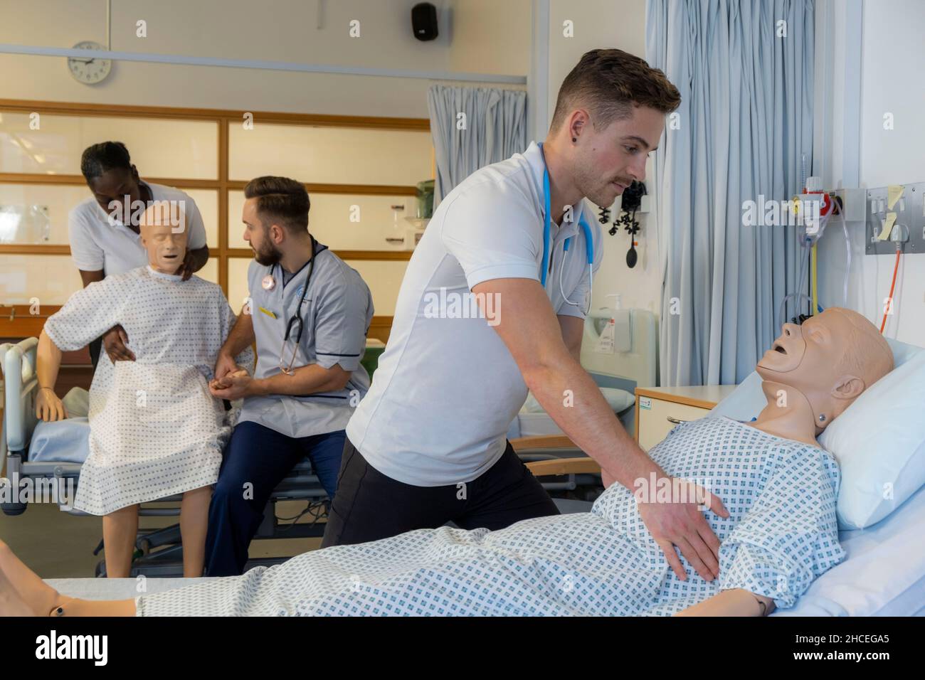Student nurses training realistic medical dummy Stock Photo - Alamy
